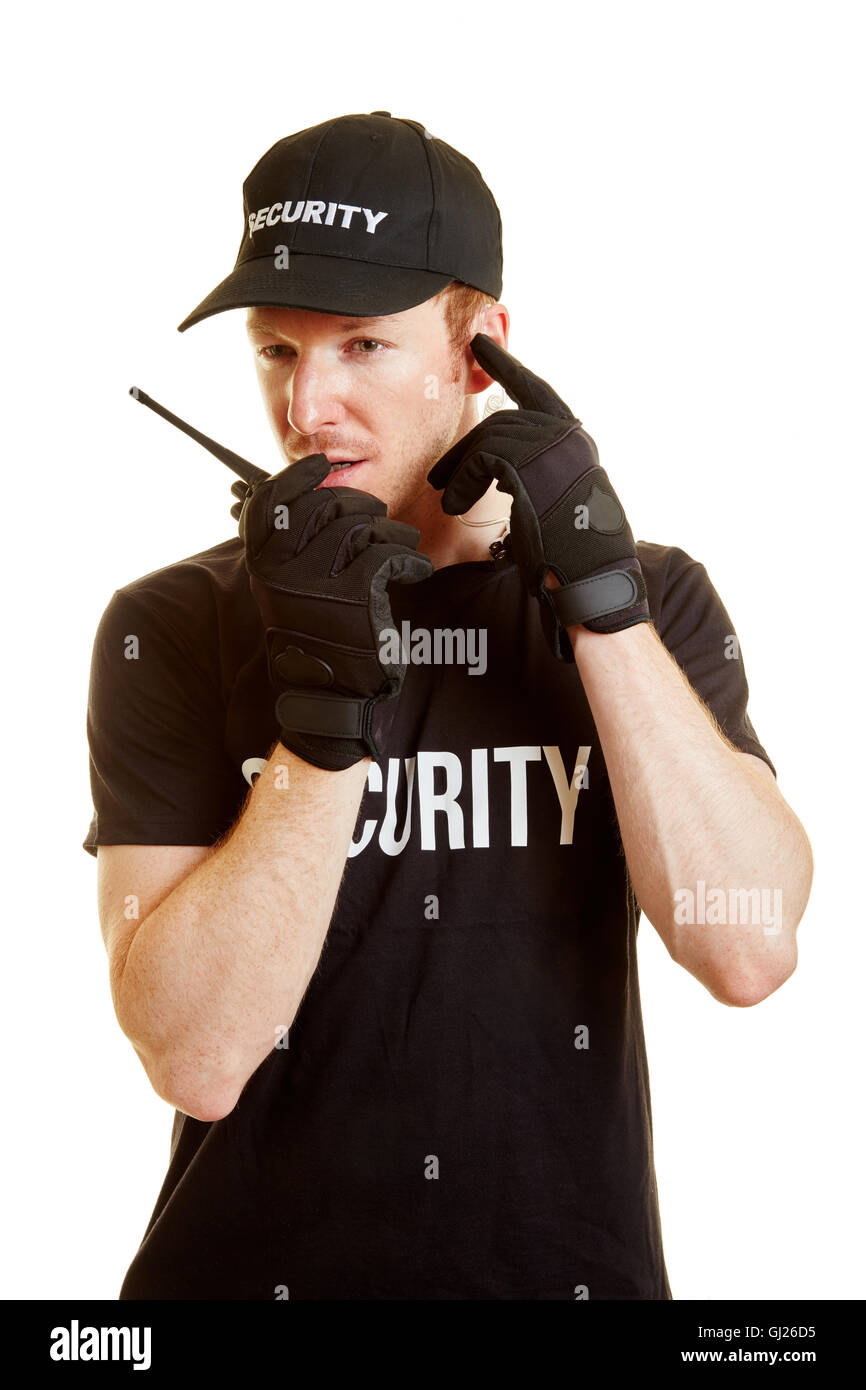 Segurity man alerts his team via radio with security clothes Stock ...