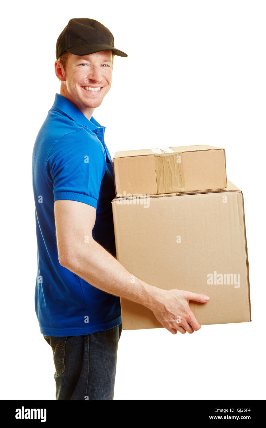 Man as a delivery guy holding packages on his hands and smiling Stock ...