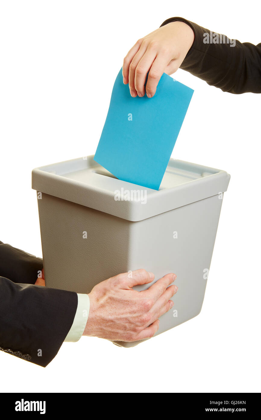 Hands of business people introducing a ballot paper in a ballot box ...