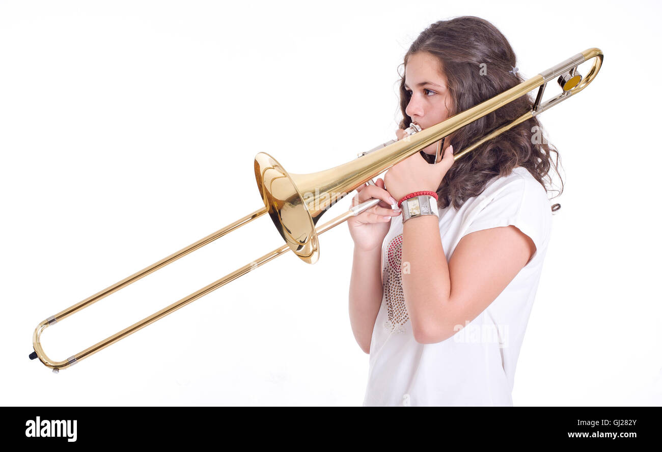 Teenage girl with trombone. Studio shot Stock Photo - Alamy