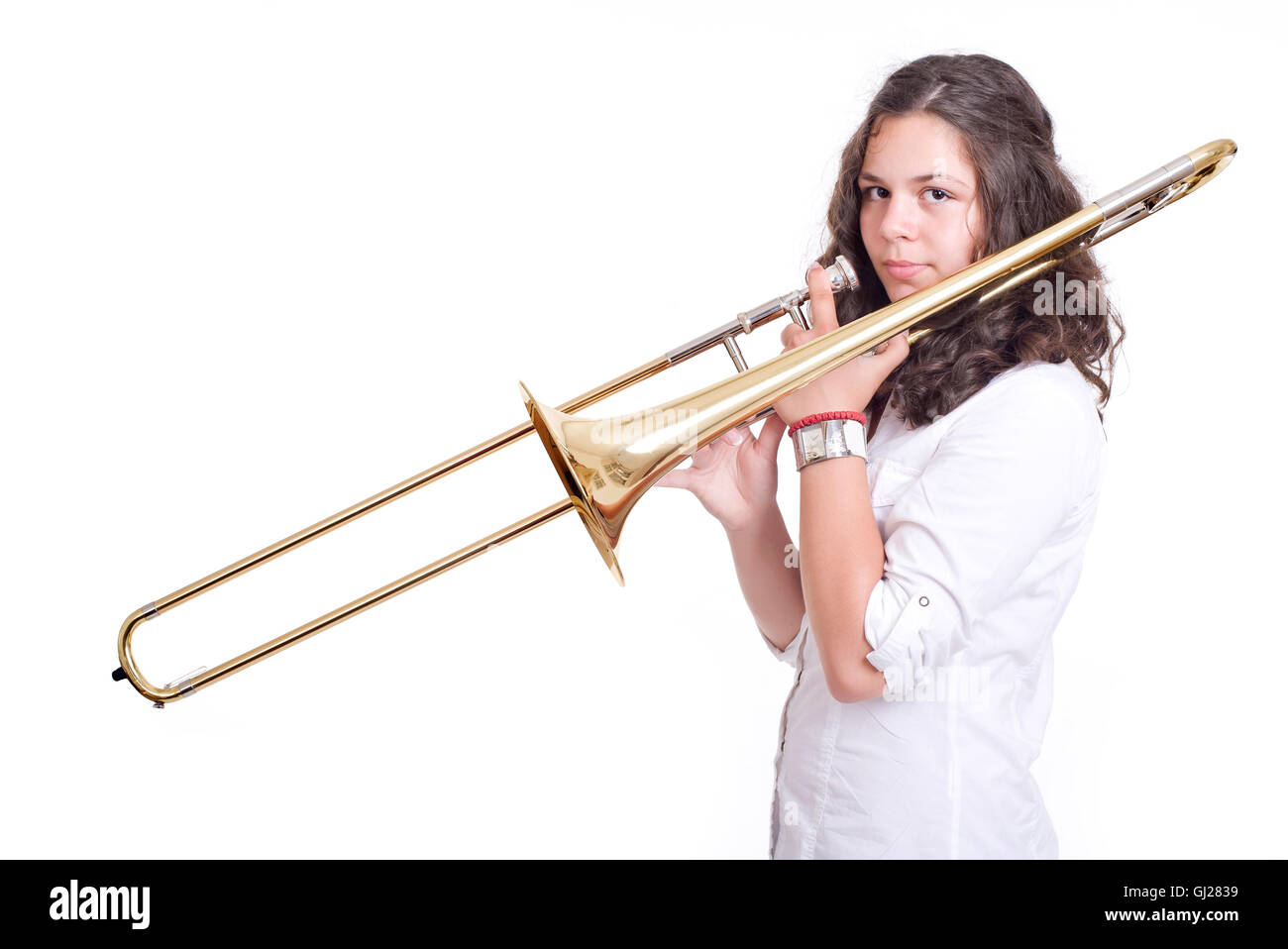 Teenage girl with trombone. Studio shot Stock Photo - Alamy