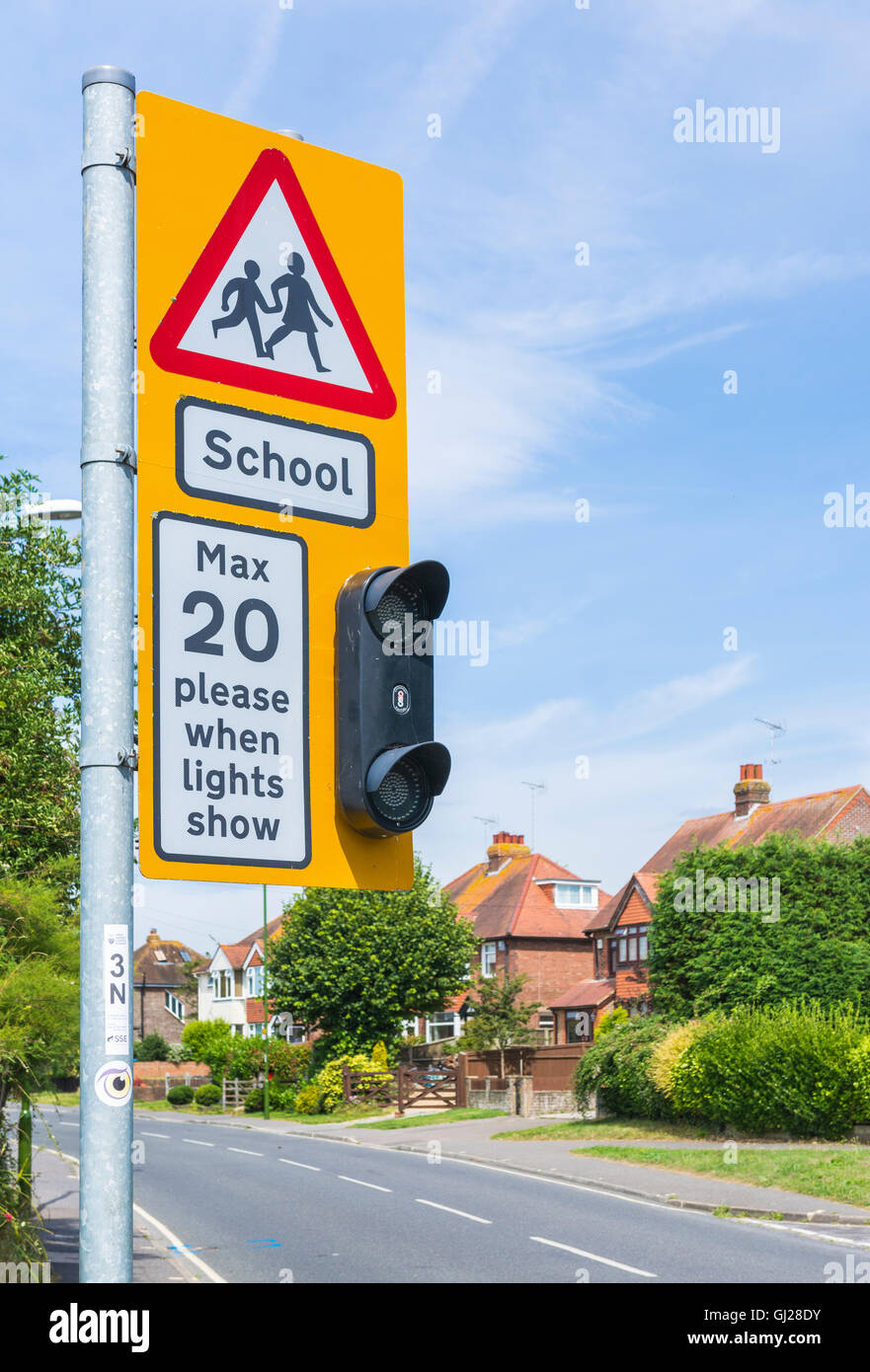 School warning sign with speed restriction on a road in the UK Stock ...