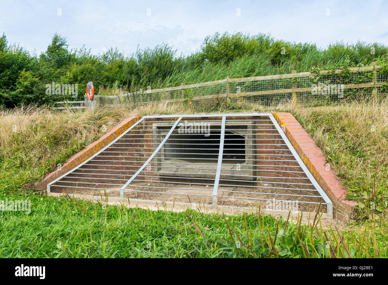 Water overflow outlet from a lake into a balancing lake or flood basin ...