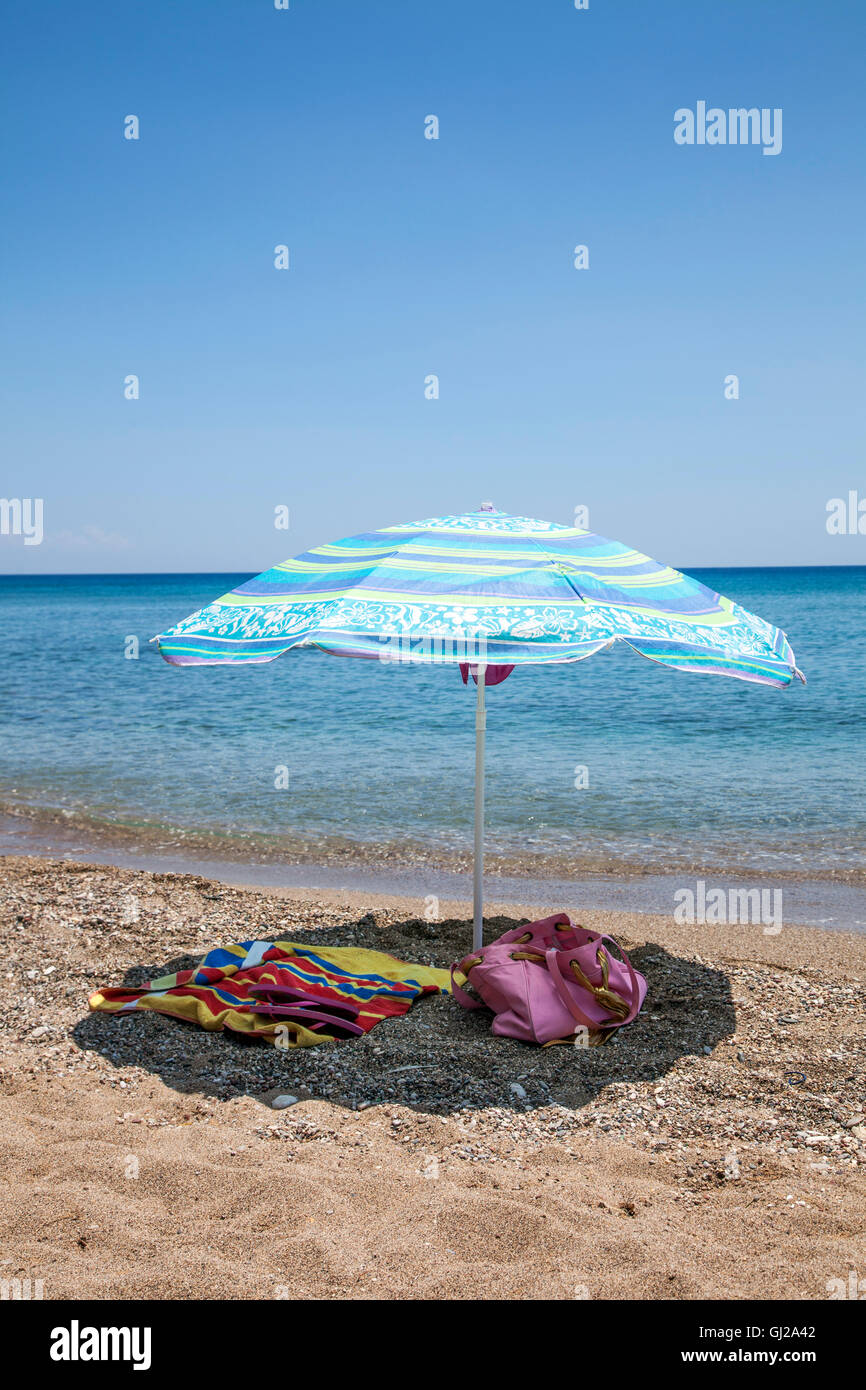 Umbrella on beach and sea Stock Photo - Alamy