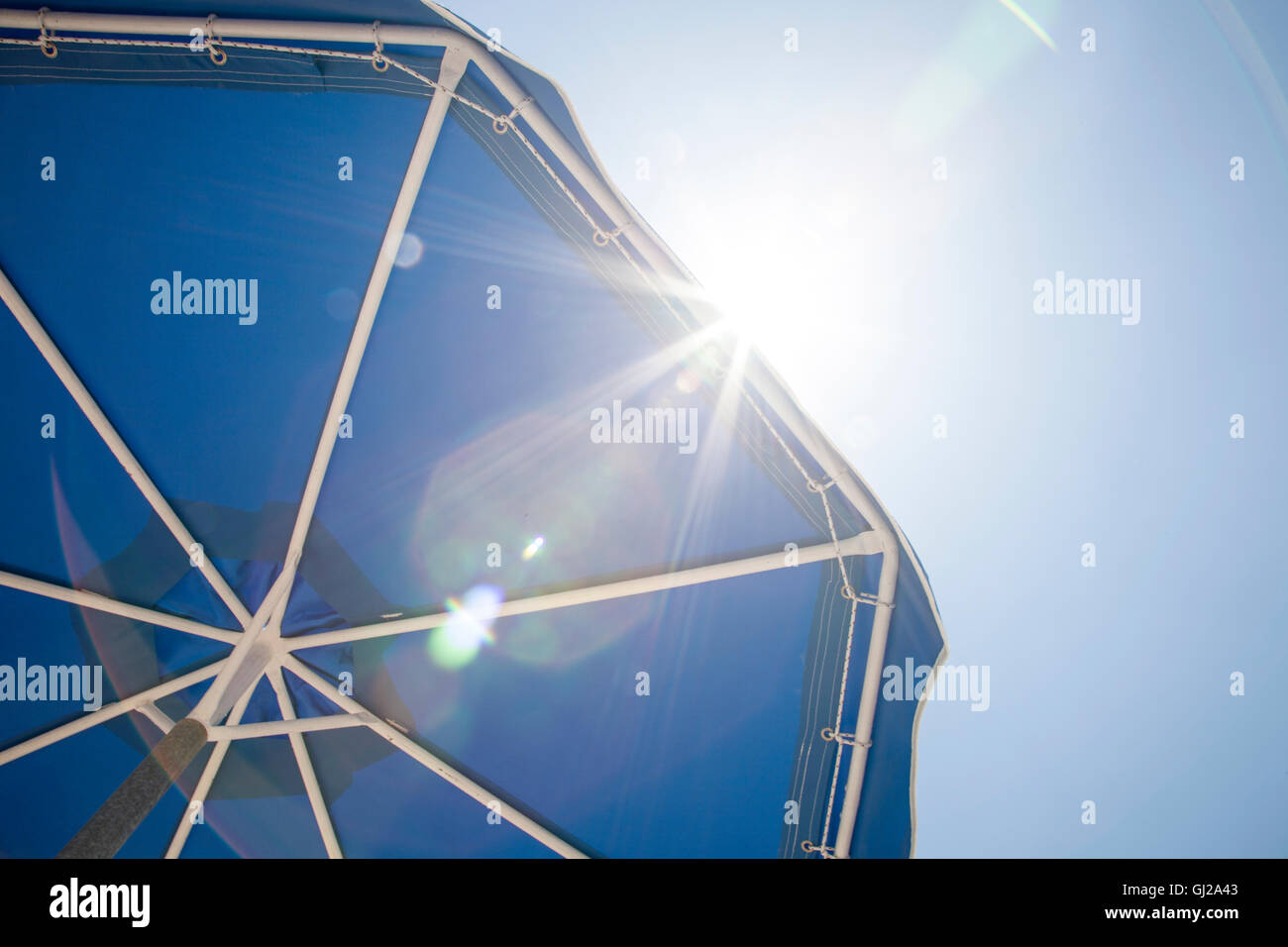 In the sun! Sun and umbrella Stock Photo - Alamy