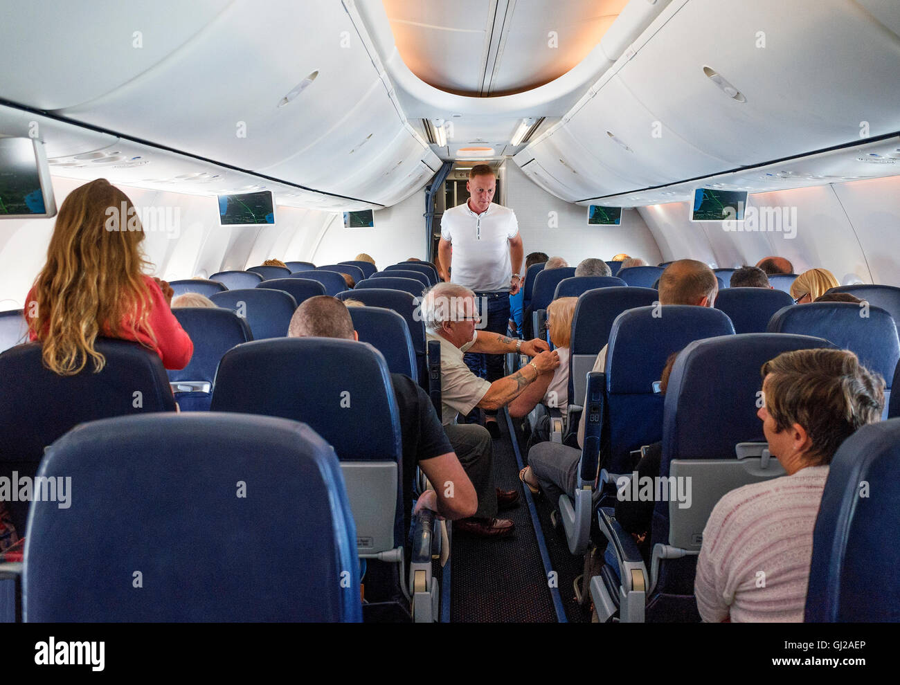 Inside the cabin of a Holiday charter flight airplane Stock Photo - Alamy