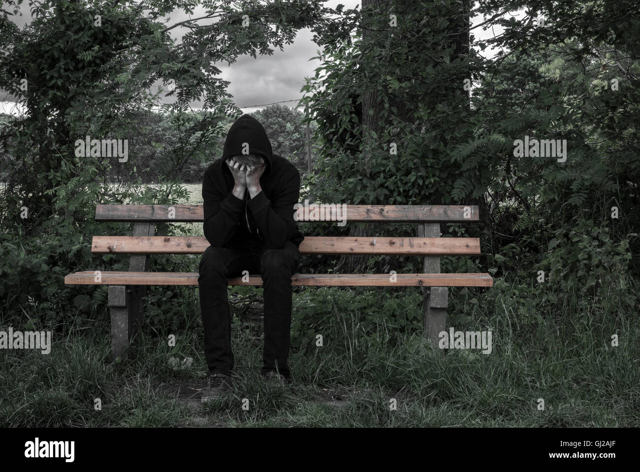 sad boy in rural landscape Stock Photo - Alamy