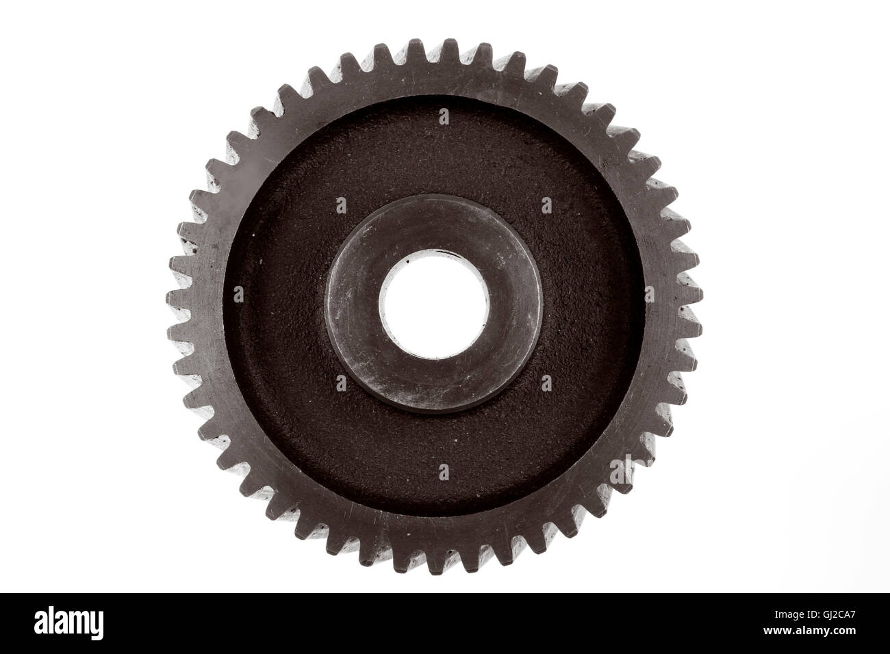 Metal gear on plain background Stock Photo - Alamy