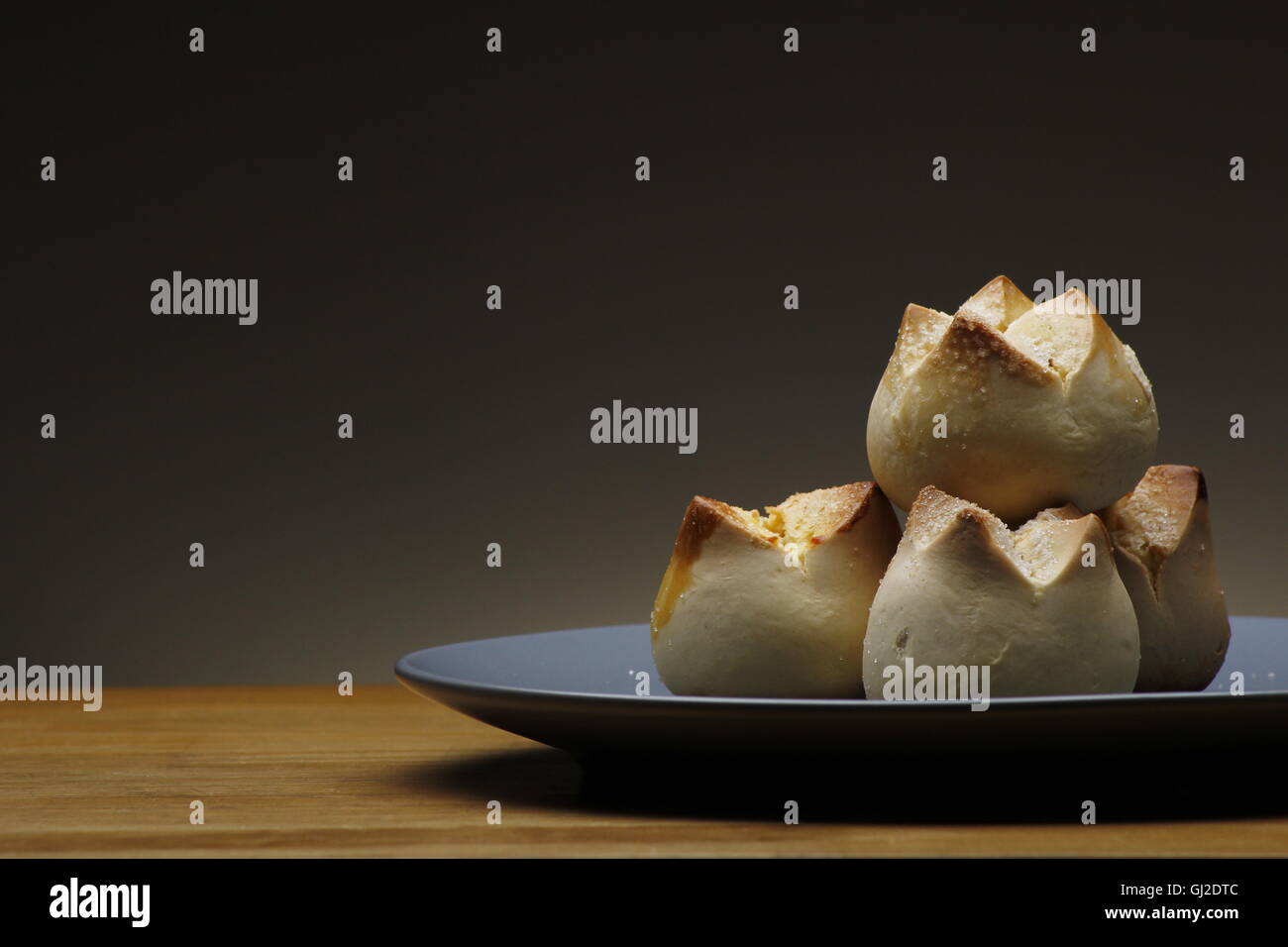 Stack of freshly baked Filipino sweet bread known as "putok Stock Photo ...