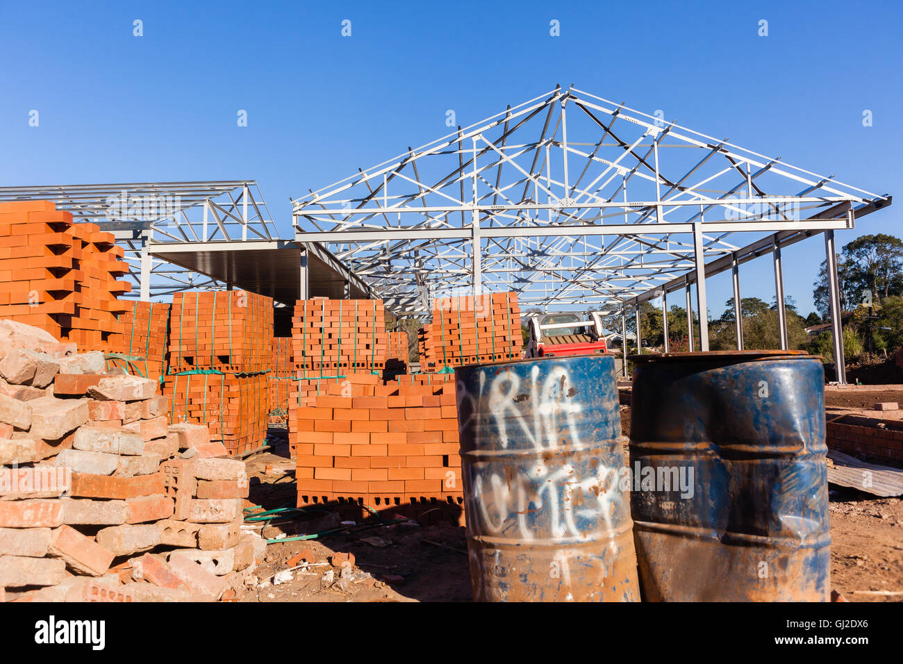Building mid construction with steel roof frame structures bricks block ...
