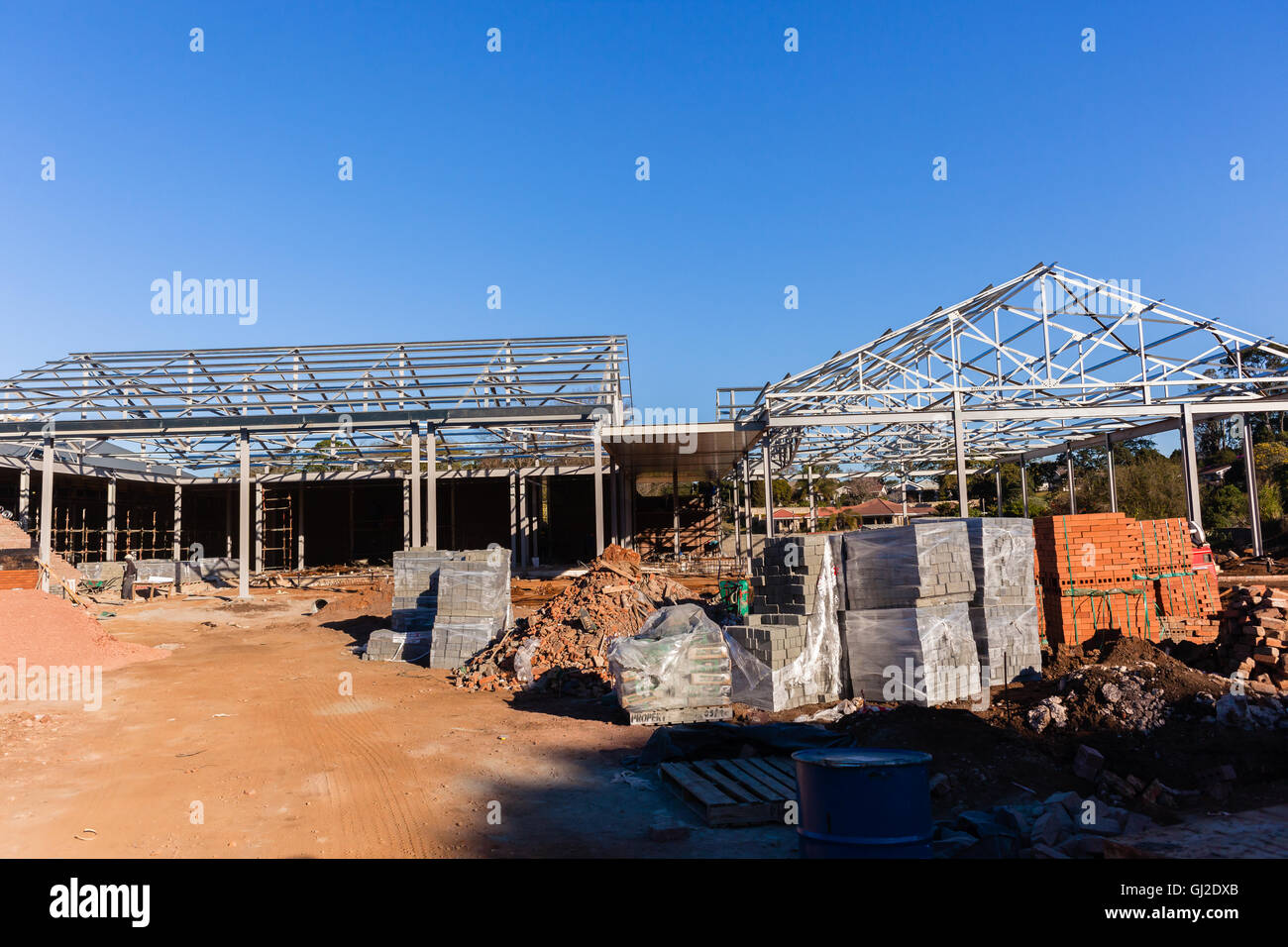 Building mid construction with steel roof frame structures bricks block ...