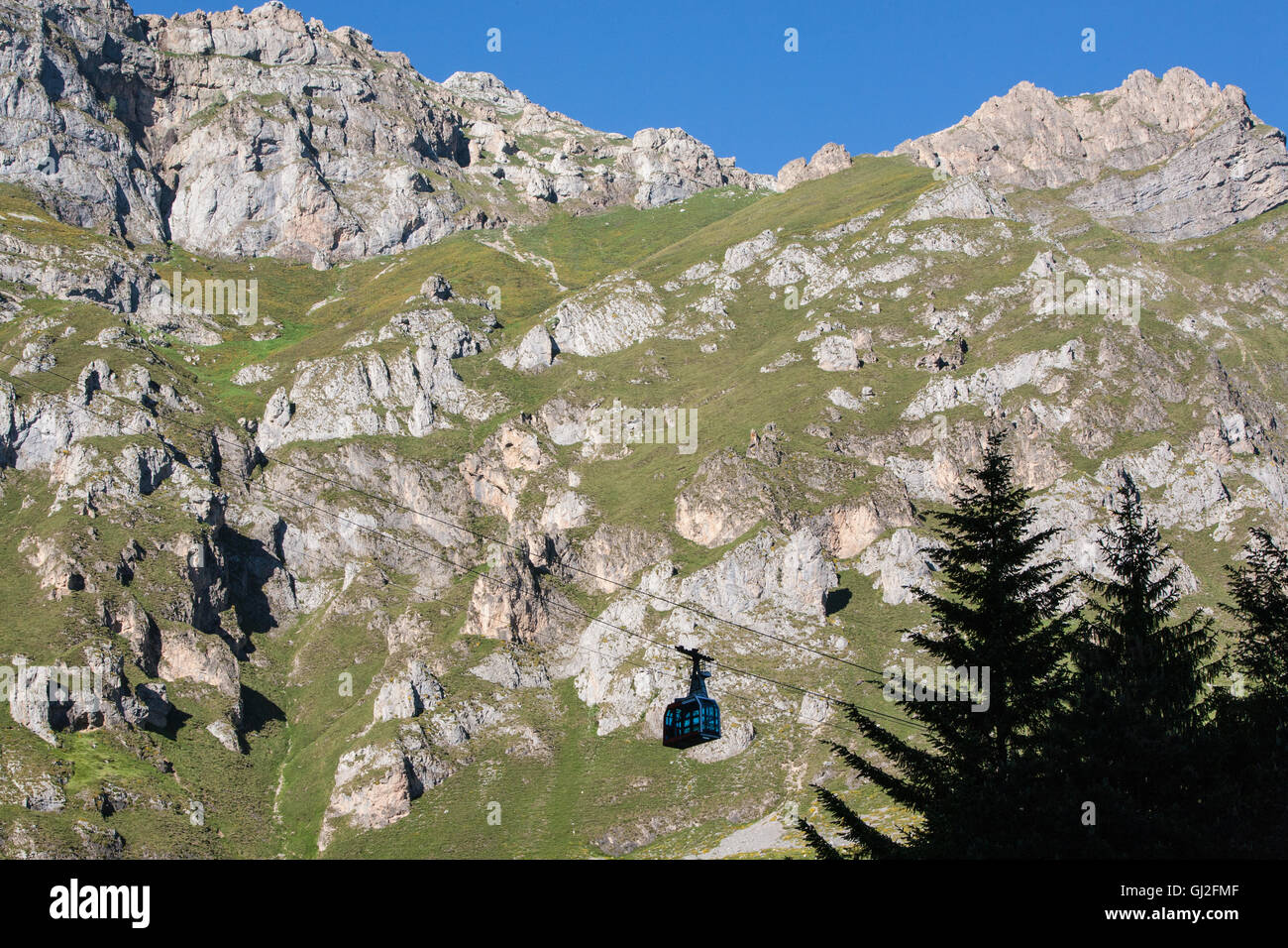 Cable car from cable car terminal at Fuente De up to high mountains of ...