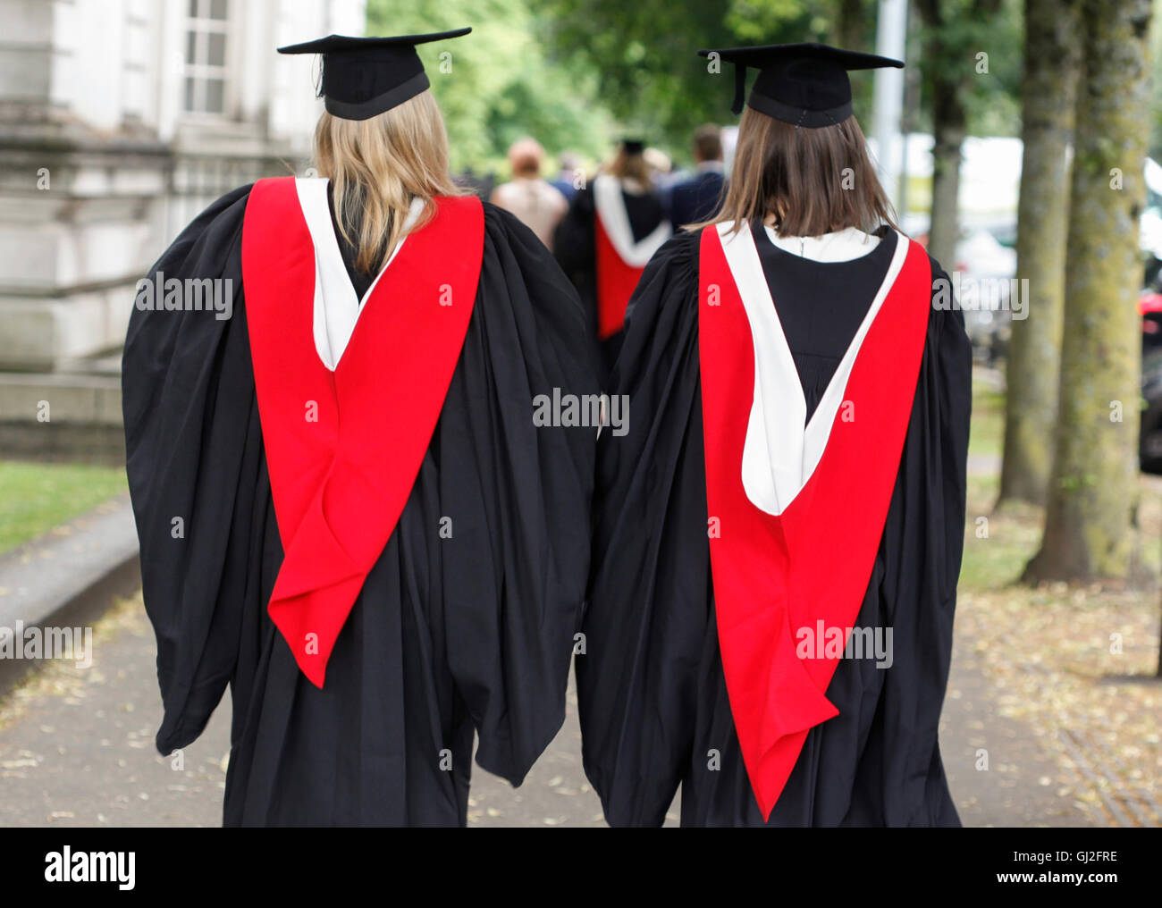 Two young women on their way to or from their graduation ceremony Stock ...