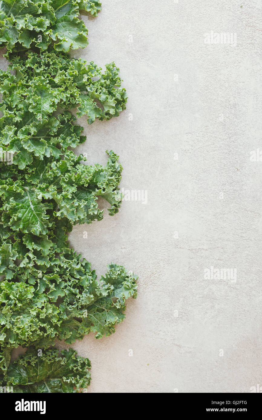 Rastan, green leafy cabbage. Border of fresh green leaves on rustic ...