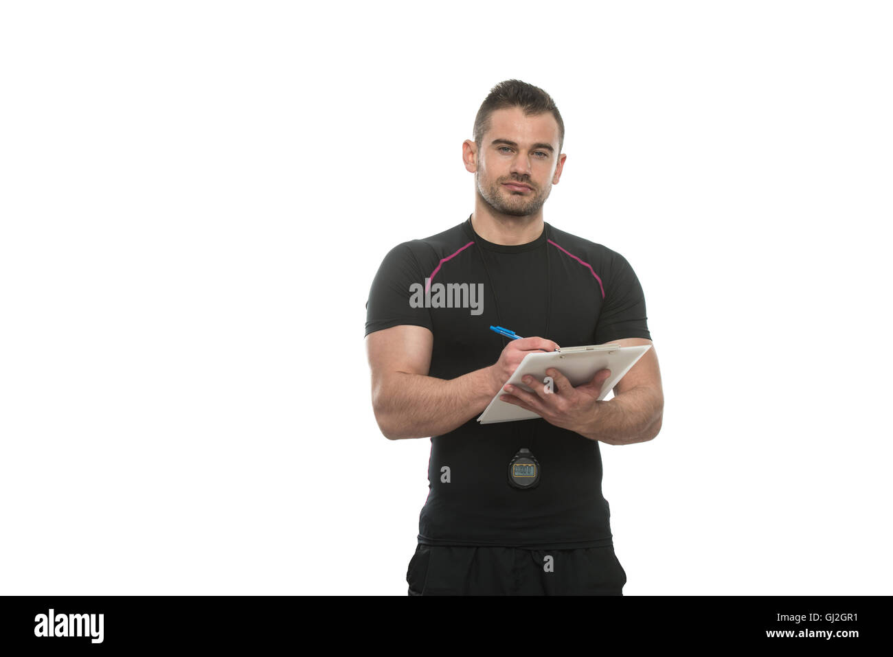 Handsome Personal Trainer With A Clipboard Isolated On A White ...