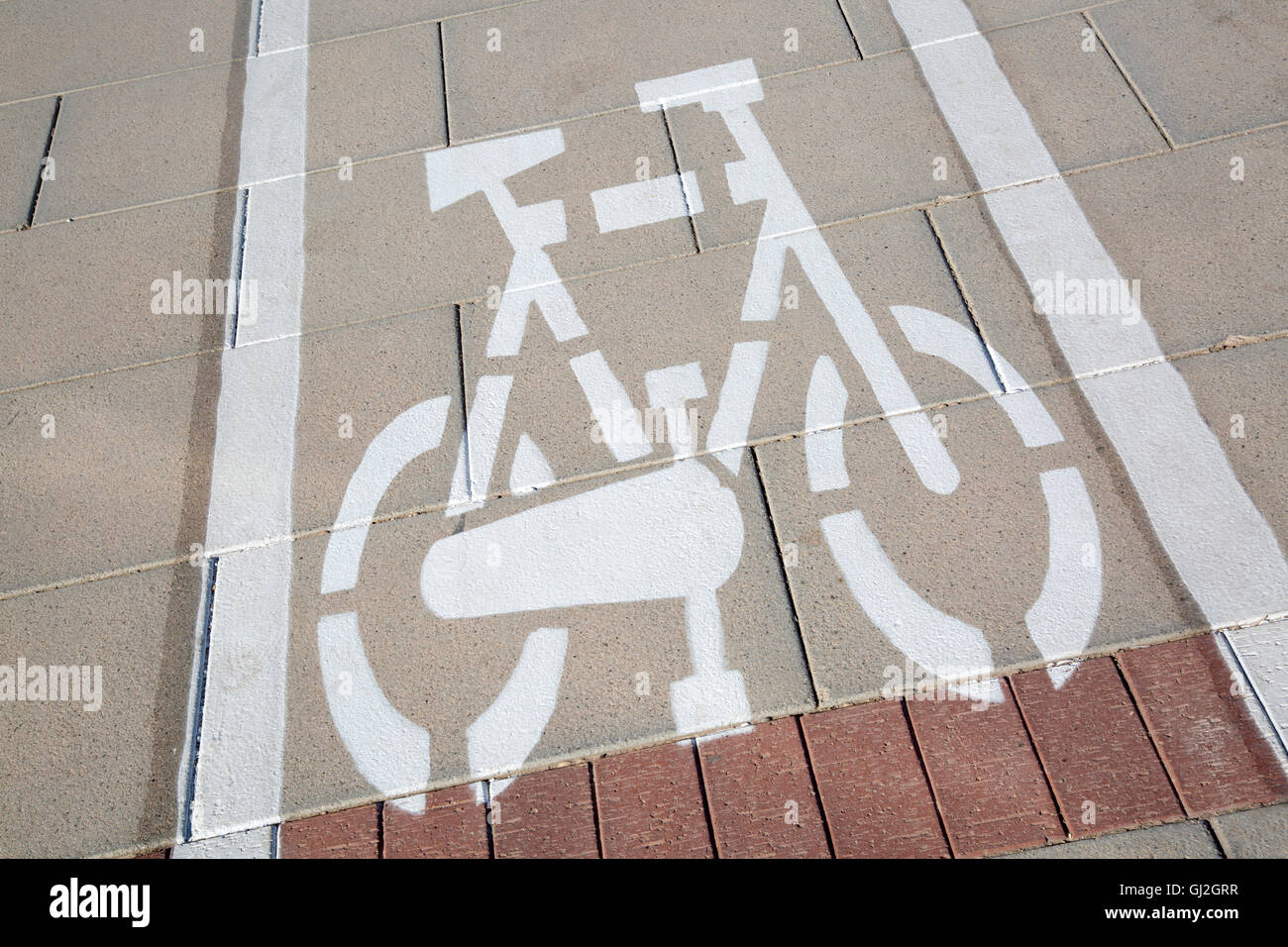 White Bike Lane Sign Painted on Pavement Stock Photo - Alamy