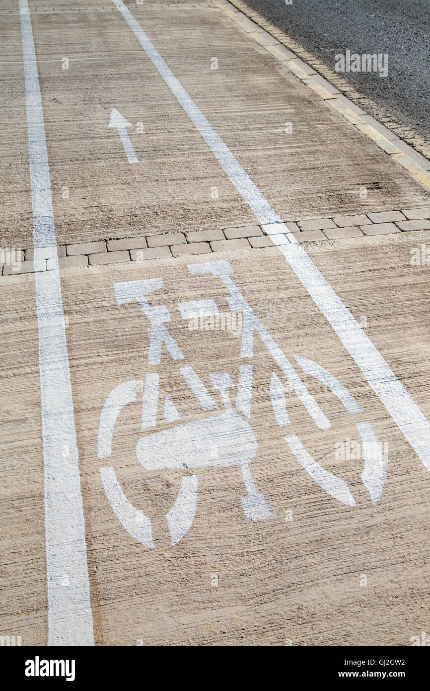 White Bike Lane Sign Painted on Pavement Stock Photo - Alamy