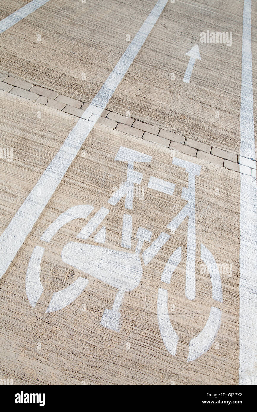 White Bike Lane Sign Painted on Pavement Stock Photo - Alamy