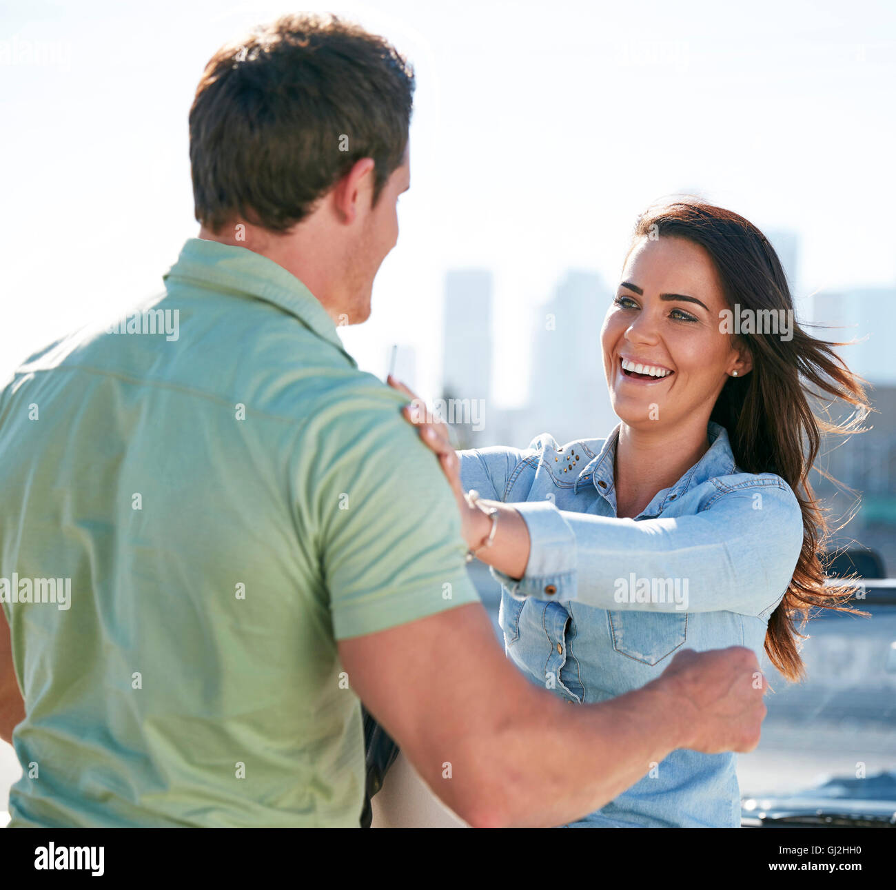 Couple hugging and smiling Stock Photo - Alamy