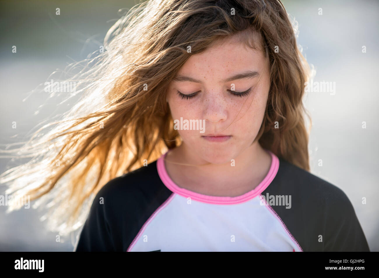 Portrait of young girl, sad expression Stock Photo - Alamy