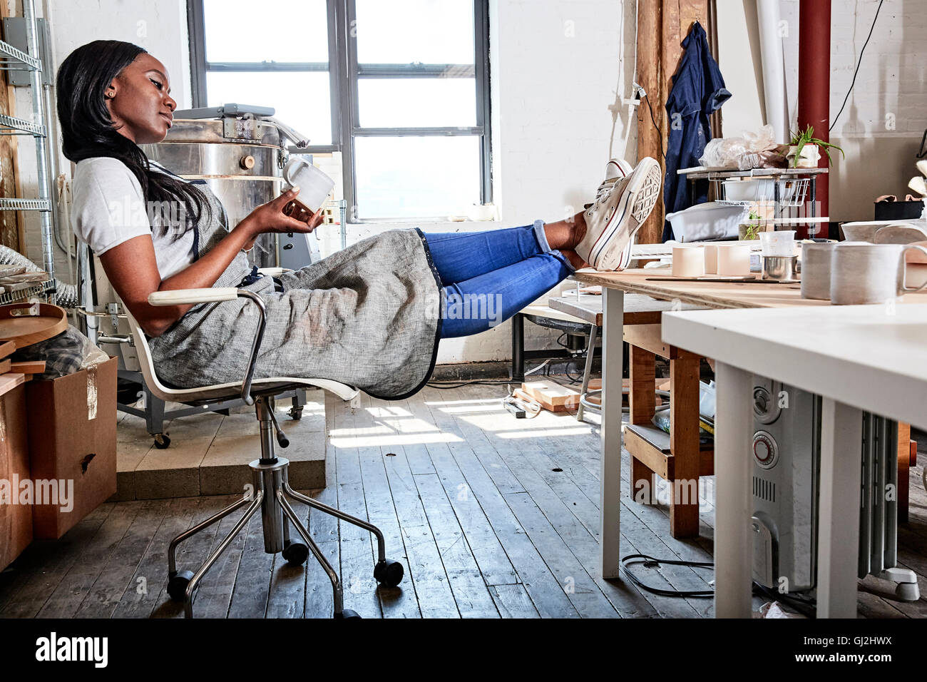 Woman feet up chair hi-res stock photography and images - Alamy