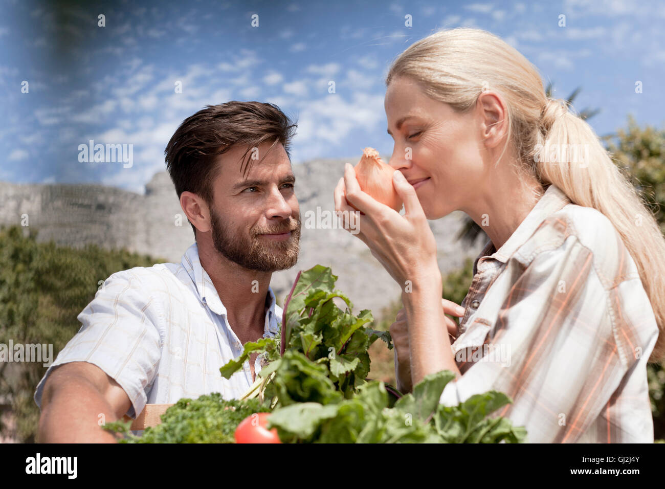 Woman smelling onion hi-res stock photography and images - Alamy
