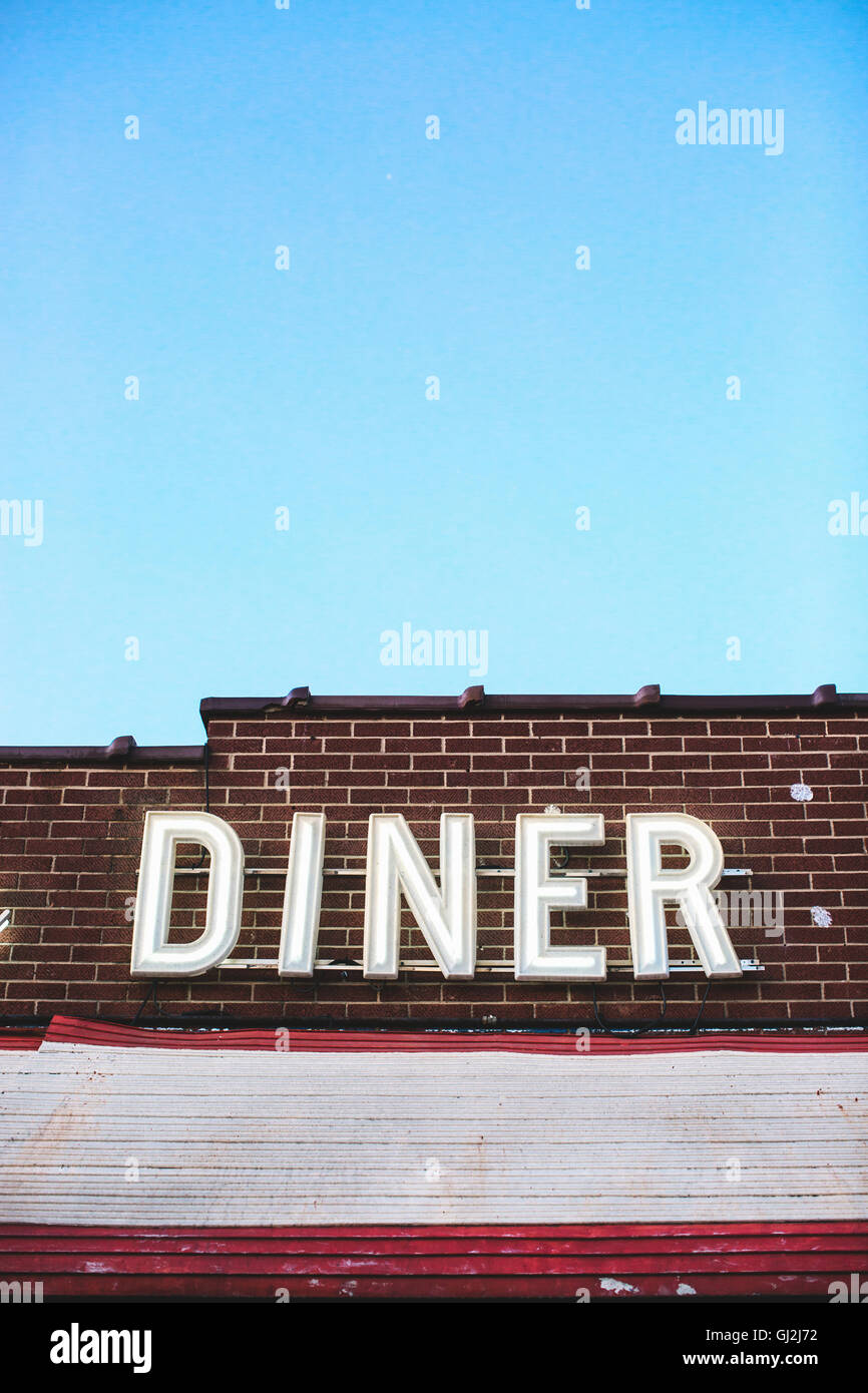 Diner signage on brick wall Stock Photo - Alamy