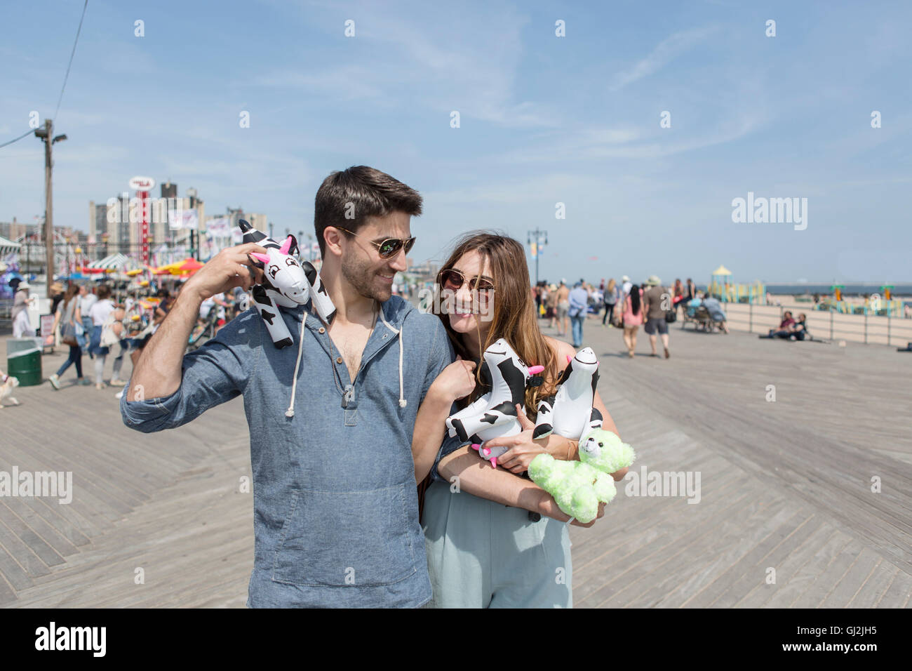 Couple holding cuddly toy cows smiling, Coney island, Brooklyn, New ...
