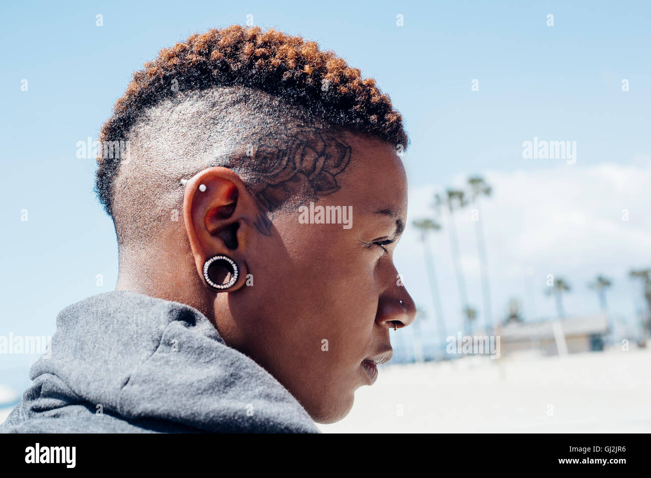 Portrait of woman with mohawk looking away Stock Photo - Alamy