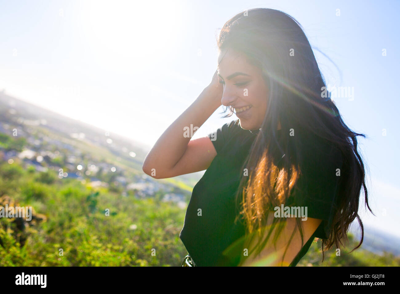 Young woman in rural setting, laughing Stock Photo - Alamy