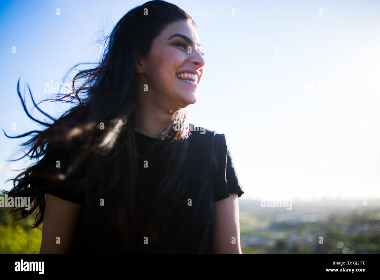 Young woman in rural setting, laughing Stock Photo - Alamy
