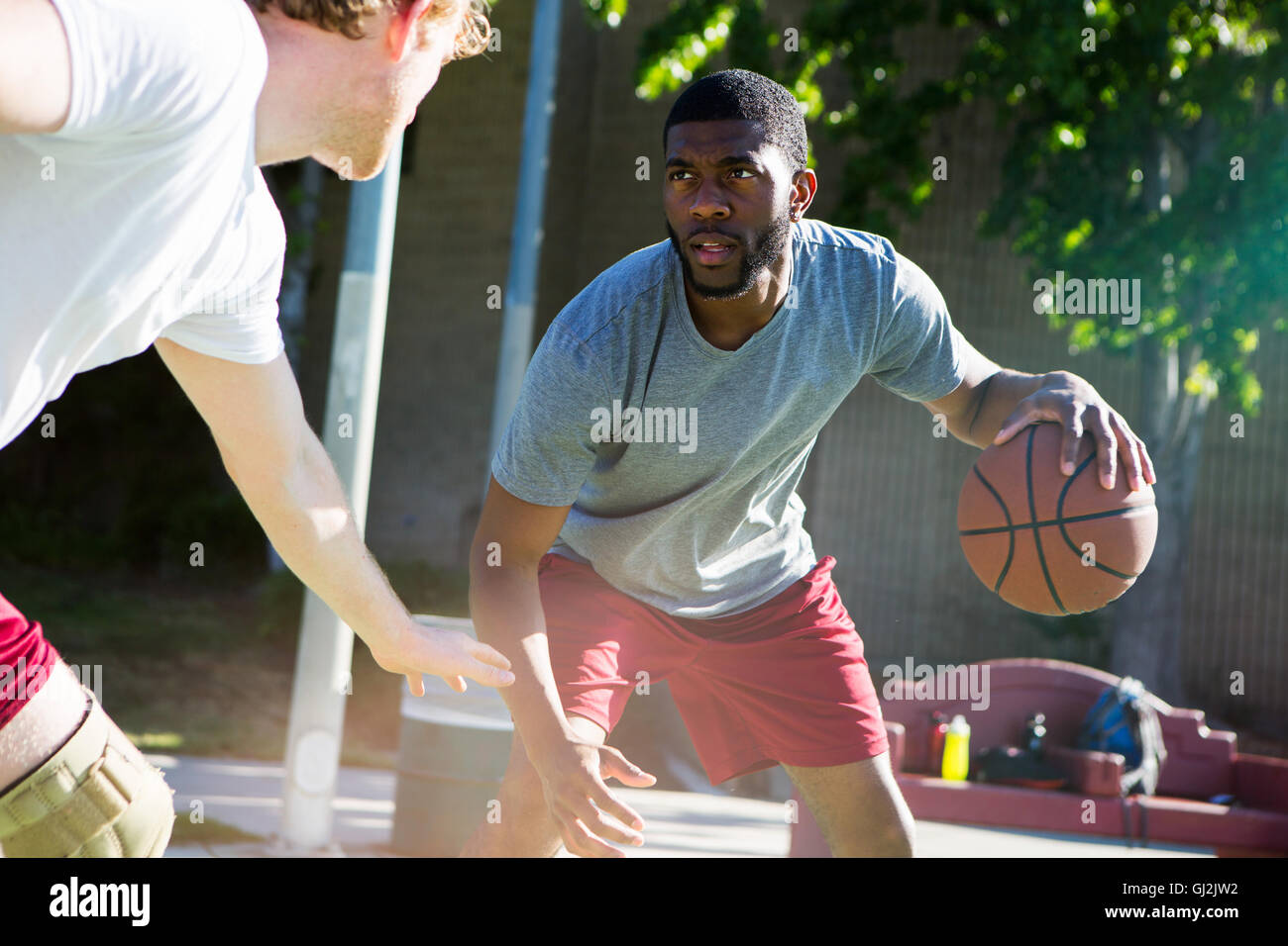 Two men playing outdoor basketball hi-res stock photography and images ...