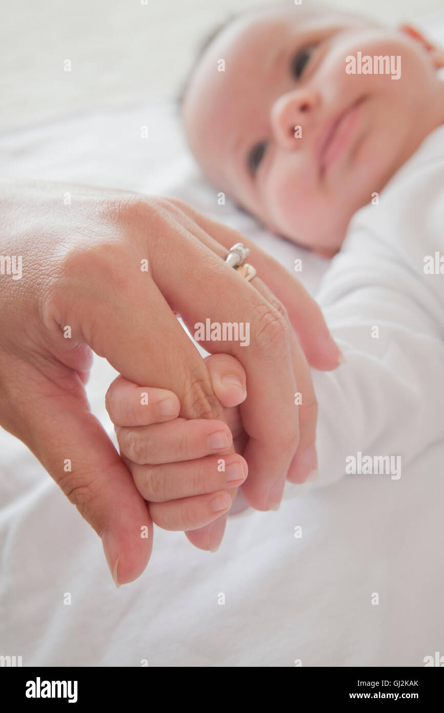 Baby hand holding finger ring hi-res stock photography and images - Alamy