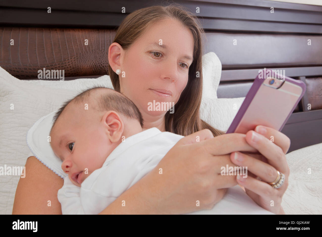 Boy on bed texting hi-res stock photography and images - Alamy