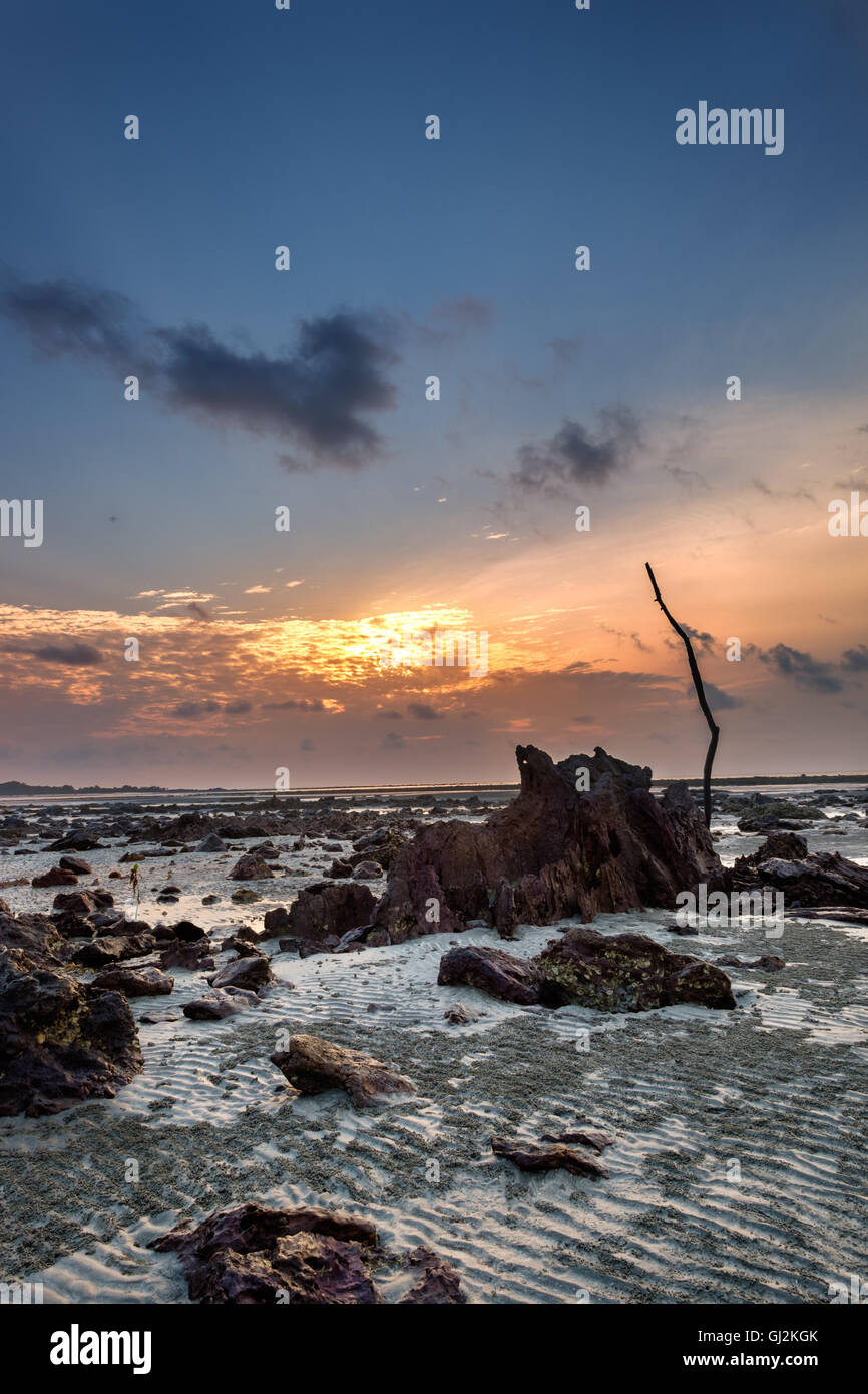 Colourful sunrise and sand when sea water left during low tide Stock ...