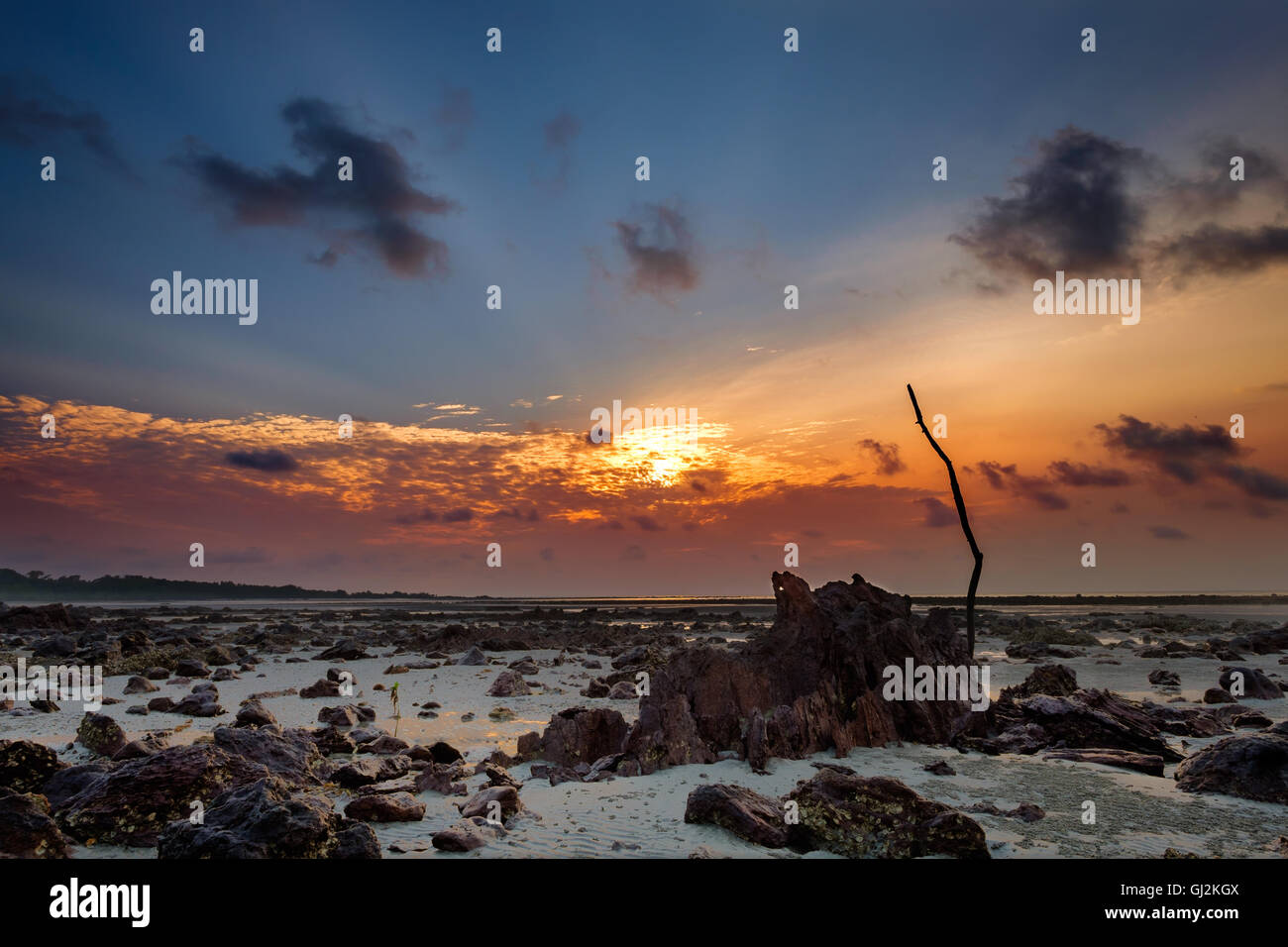 Colourful sunrise and sand when sea water left during low tide Stock ...