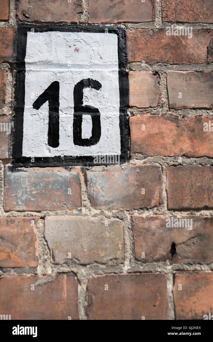 Striking and graphic door number 16 and door furniture details around ...