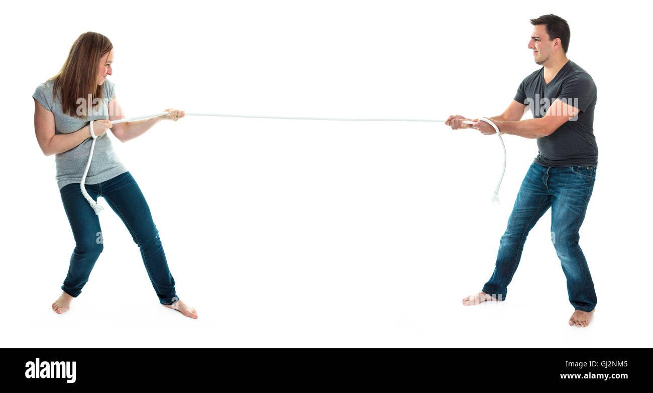 A couple on studio white background pull the rope Stock Photo - Alamy