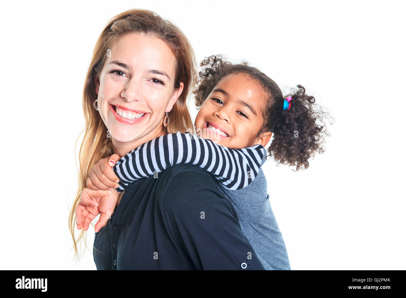 A family posing on a white background studio piggyback Stock Photo - Alamy