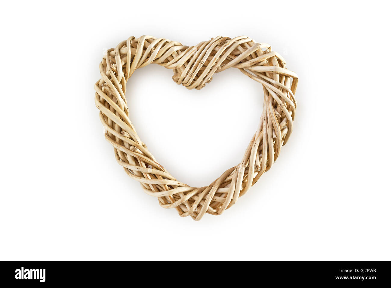 Weaved wooden heart isolated on white background Stock Photo - Alamy