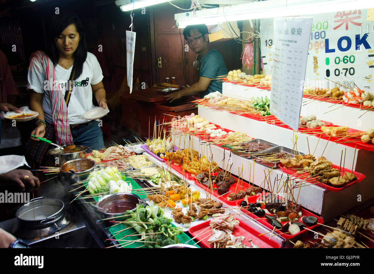 People buy and cook Lok Lok food malaysian style at restaurant in ...