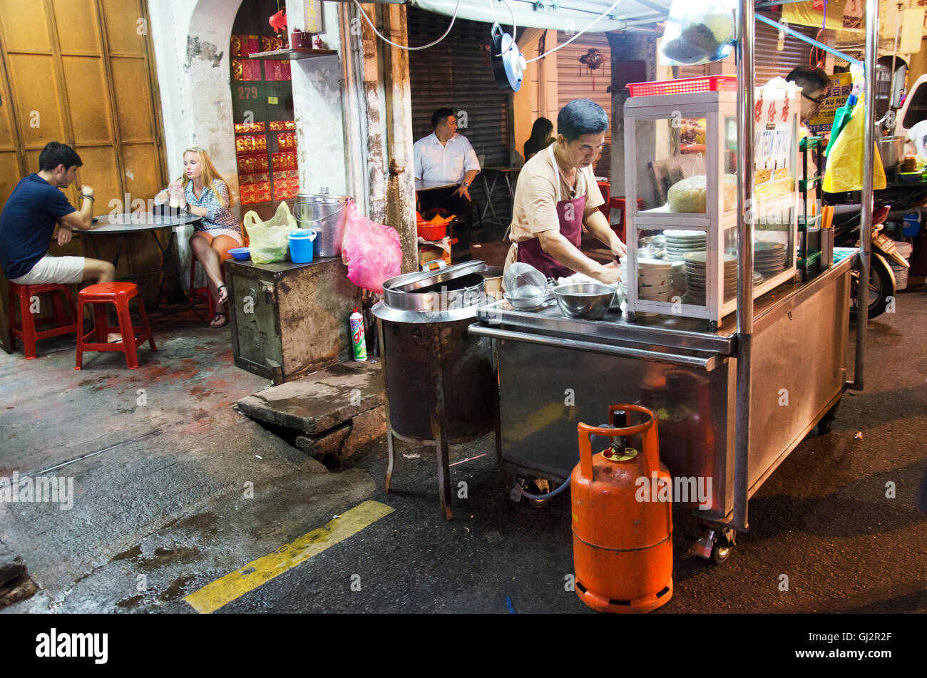 Malaysian people cooking food at Night market in Georgetown on April 25 ...