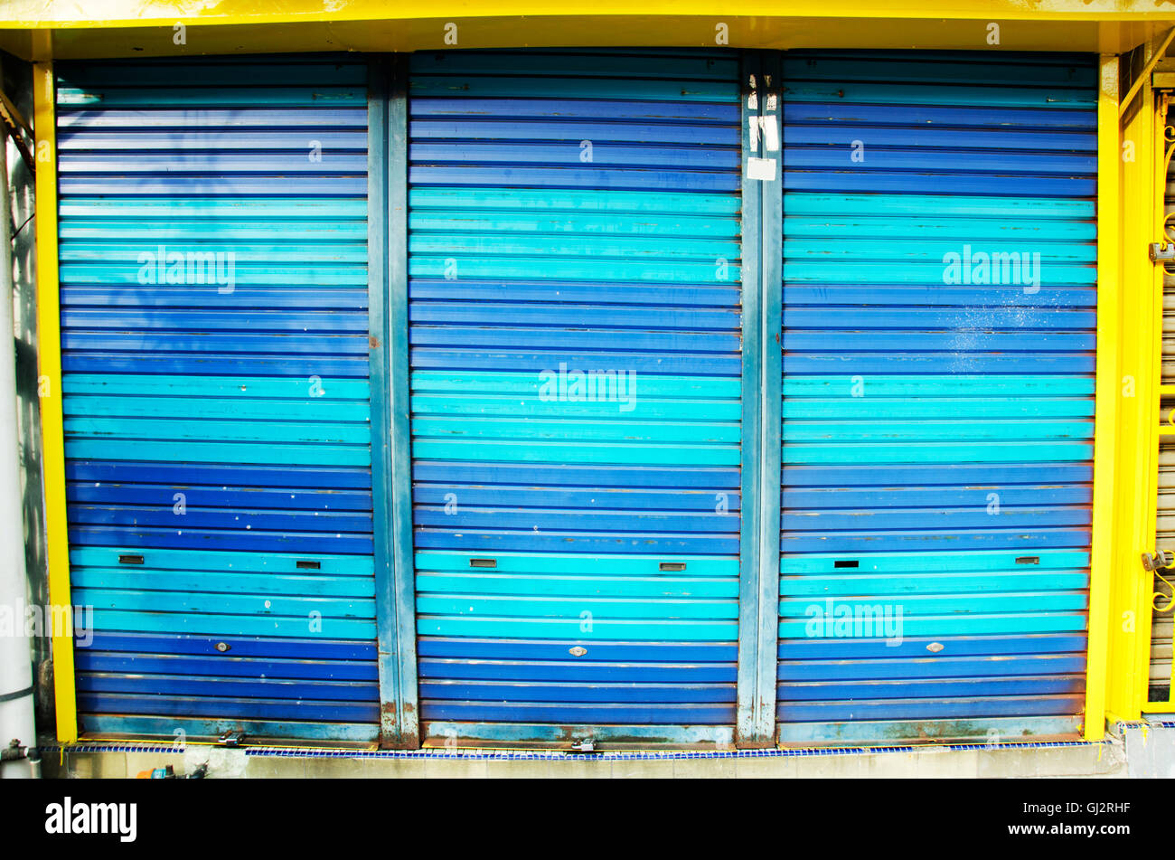 Colorful steel door roll shutter at home in George Town and street art ...
