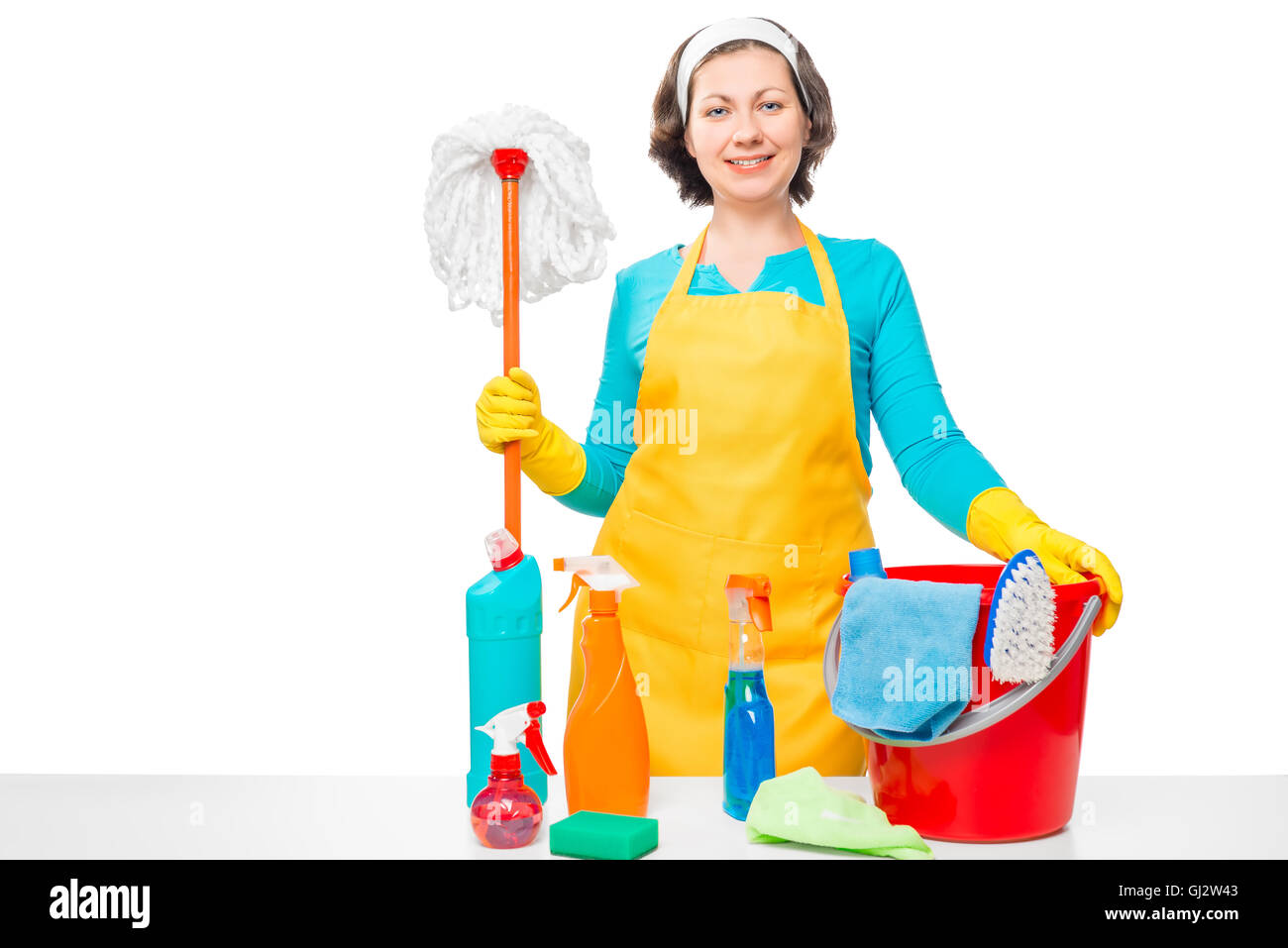 beautiful housewife with tools for house cleaning posing on a white ...