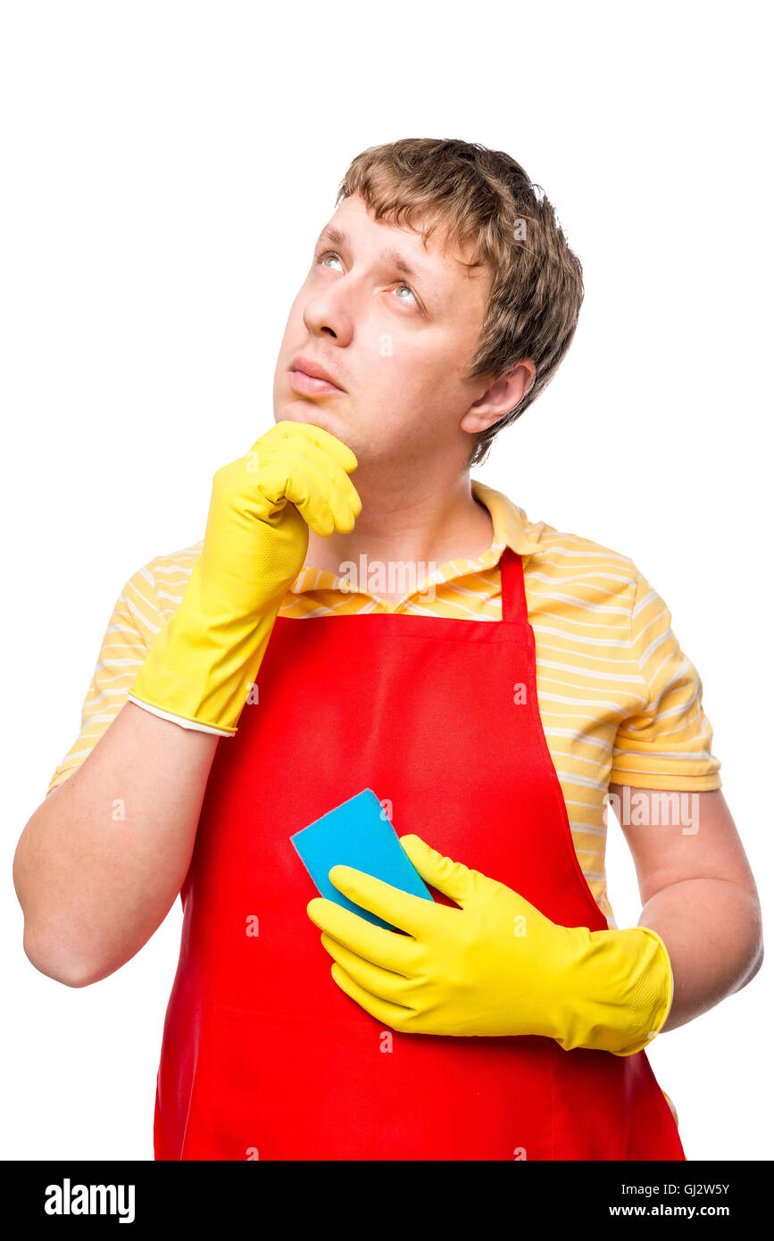 thoughtful male in an apron with a sponge on a white background Stock ...