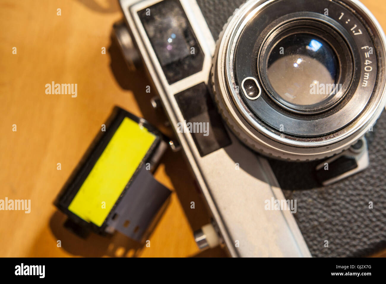 Antique SLR or Reflex camera with film roll over wooden surface Stock ...