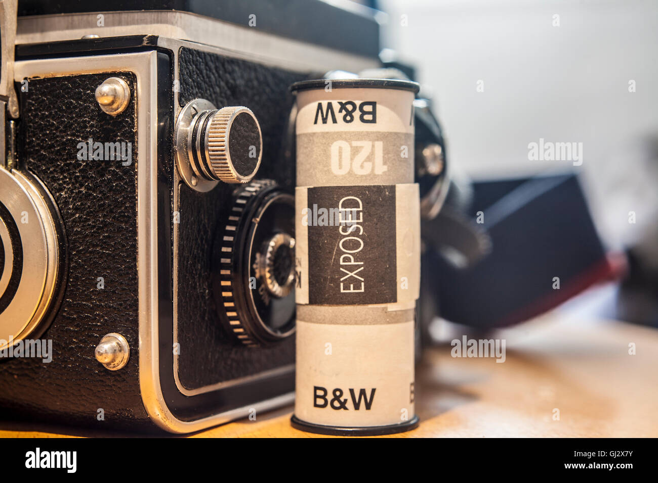 Antique TLR or Twin-Lens Reflex camera with black and white film roll ...