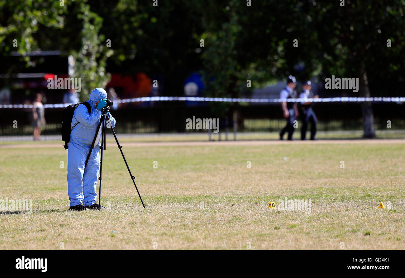 A police forensics officer at the scene in Hyde Park, London, after a ...