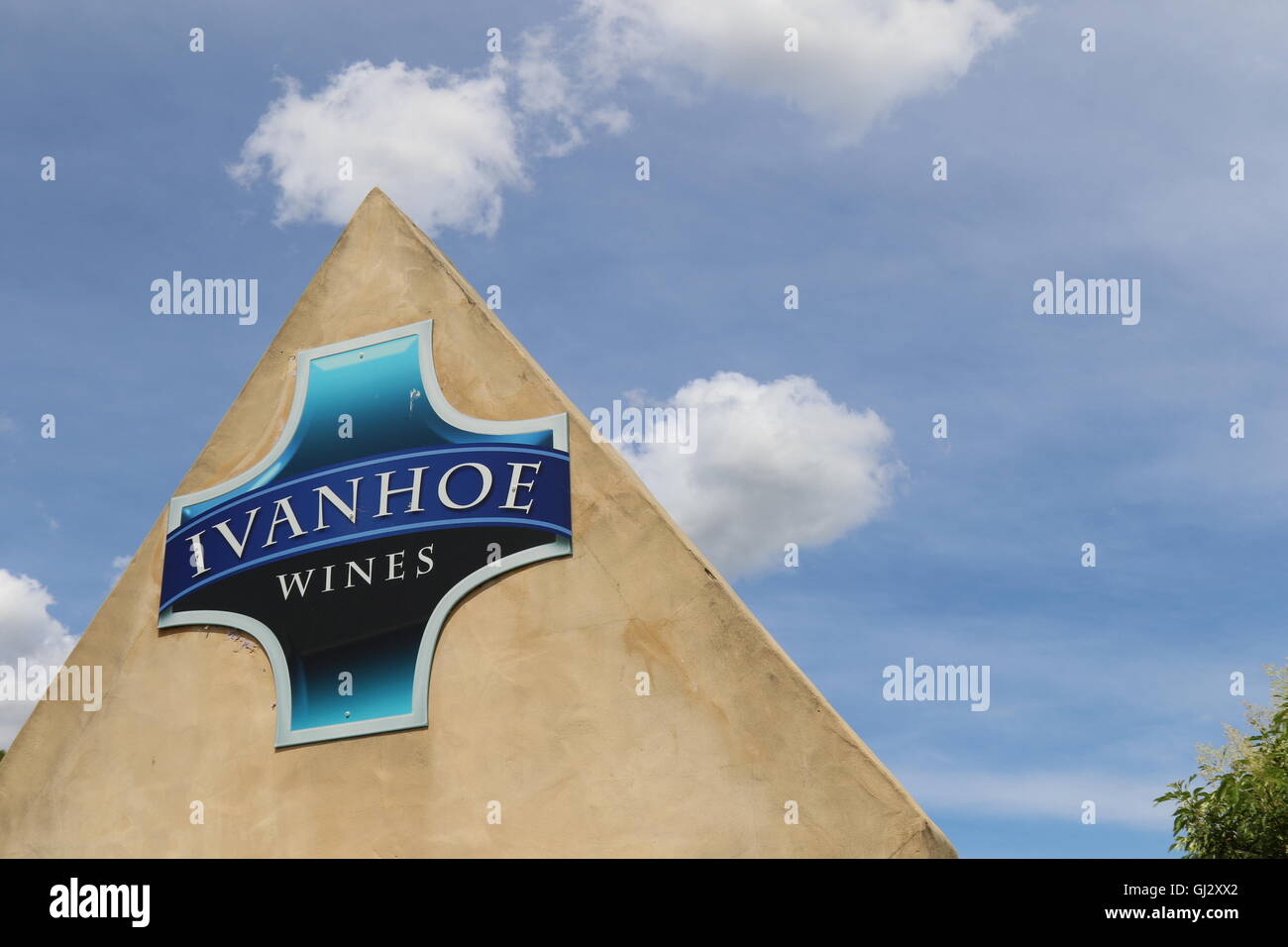 Signpost on a building with blue sky and clouds at Ivanhoe Wines ...