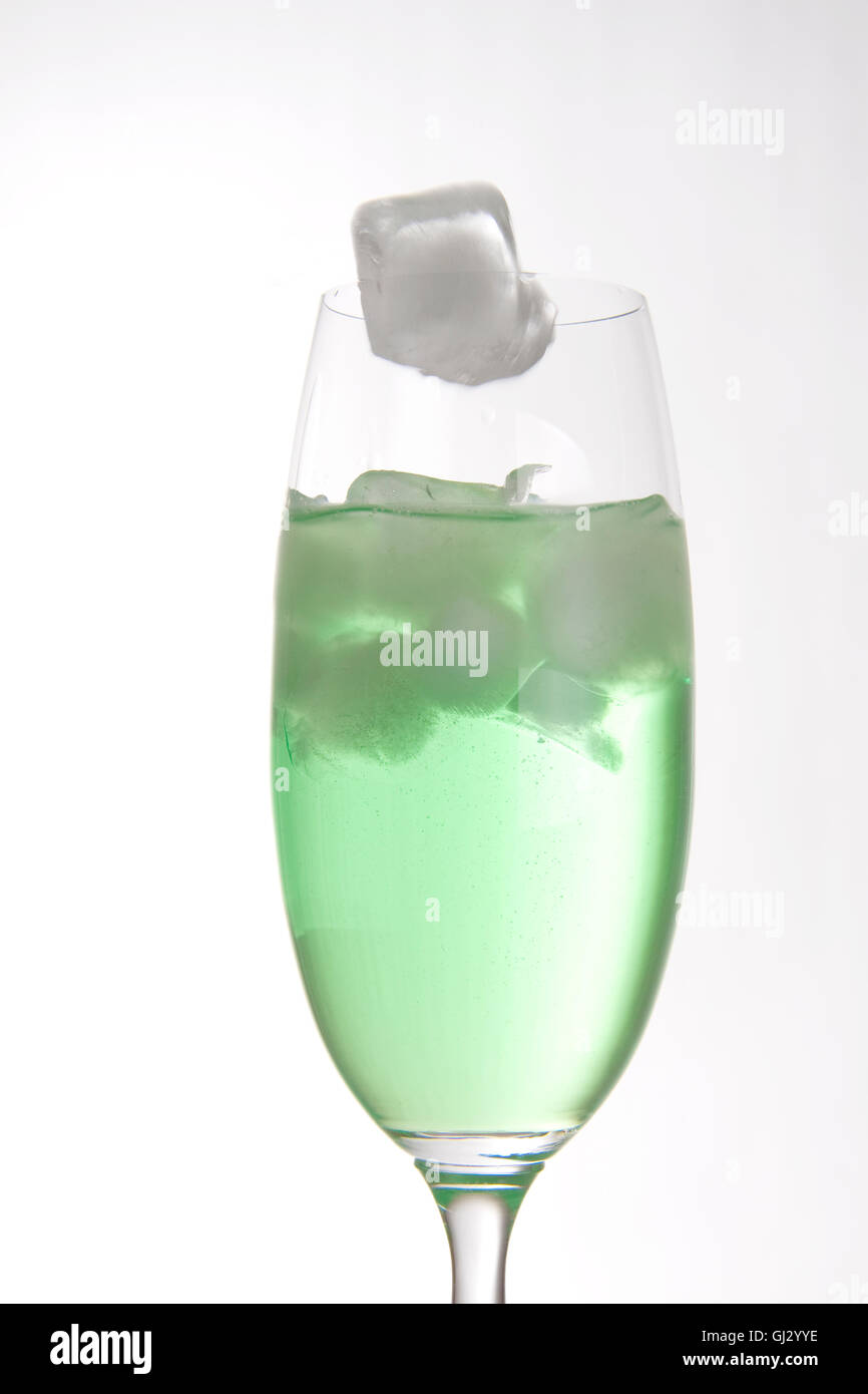 Ice cube falling Stock Photo - Alamy